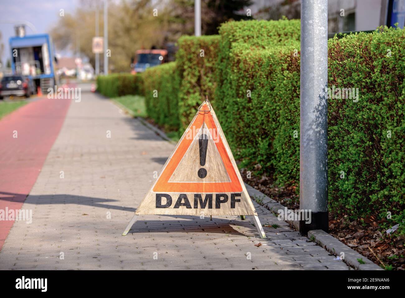 Warning triangle with the inscription steam Stock Photo - Alamy