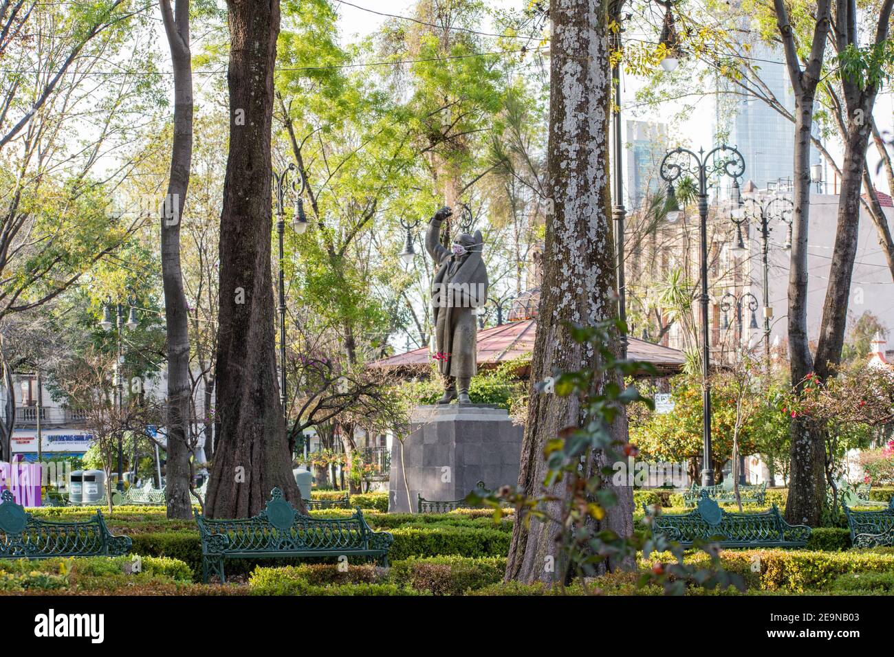 Statue of Mexican historical figure wearing face masks in park Stock ...