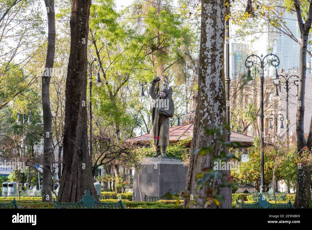 Statue of Mexican historical figure wearing face masks in park Stock ...