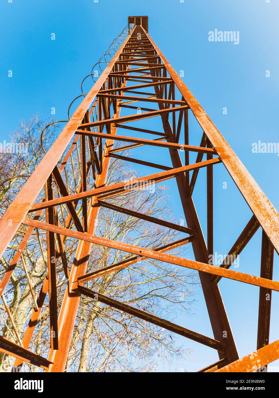 Old rusty watch tower. Old public loudspeakers broadcast on high tower ...