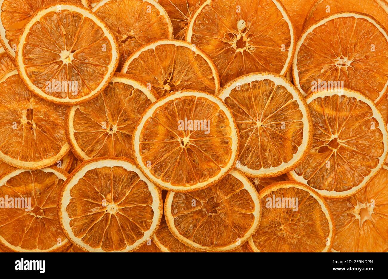 Close up many dried crispy orange ring chips on retail display ...