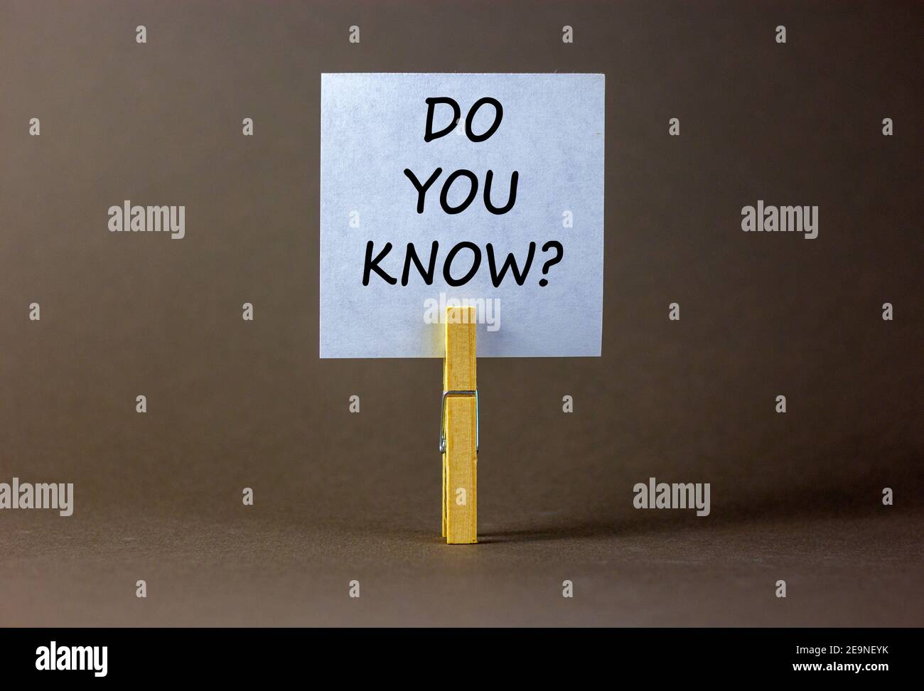 Do you know symbol. White paper with words 'do you know', clip on wood ...
