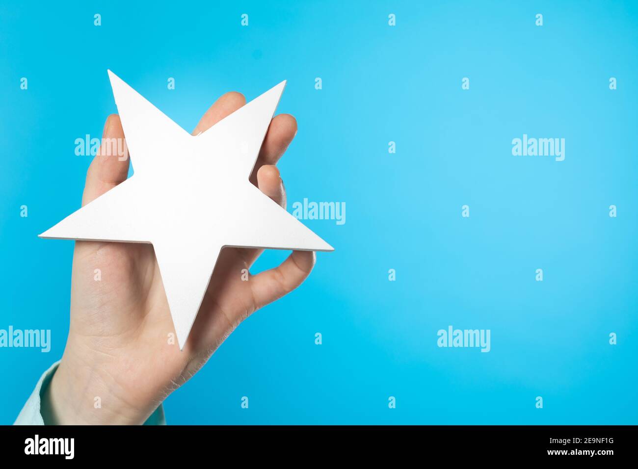 Geometric figure. A five-pointed star was beating. Young female hand ...