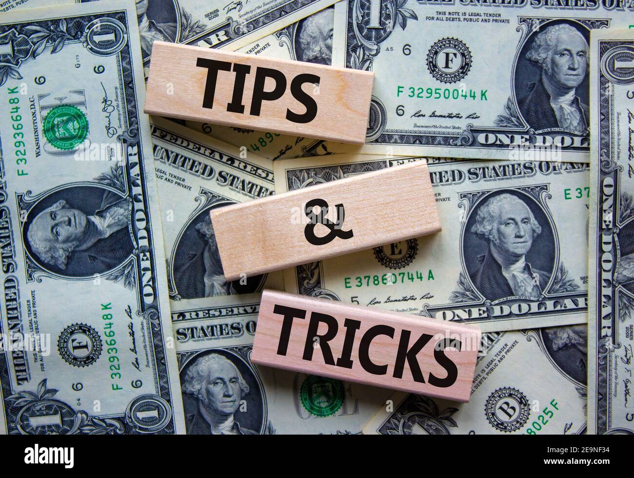 Tips and tricks symbol. Wooden blocks with words 'Tips and tricks ...