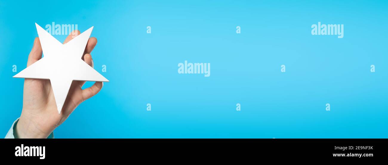 Geometric figure. A five-pointed star was beating. Young female hand ...