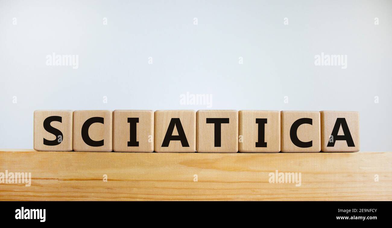 Sciatica symbol. Wooden cubes with word 'sciatica'. Beautiful white ...
