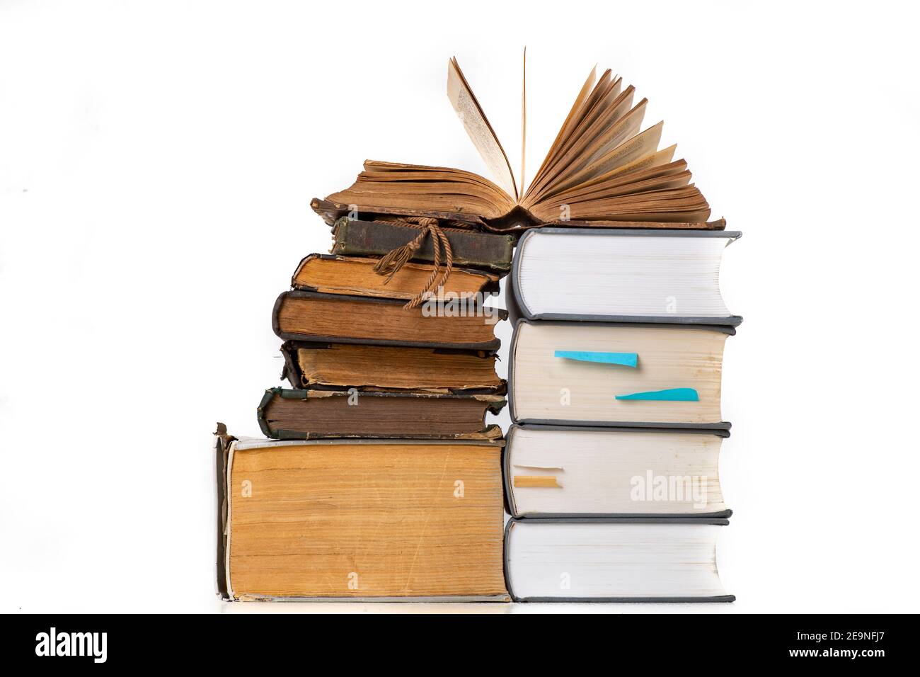 A pile of old publications in the library. Books and old open brochures ...