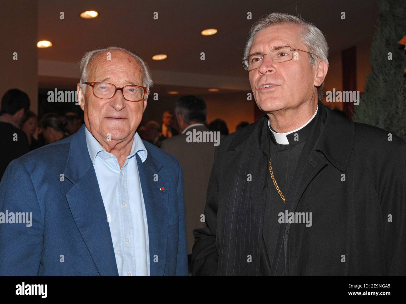 Bishop Jean-Michel Di Falco and author Alain Decaux pose for pictures ...