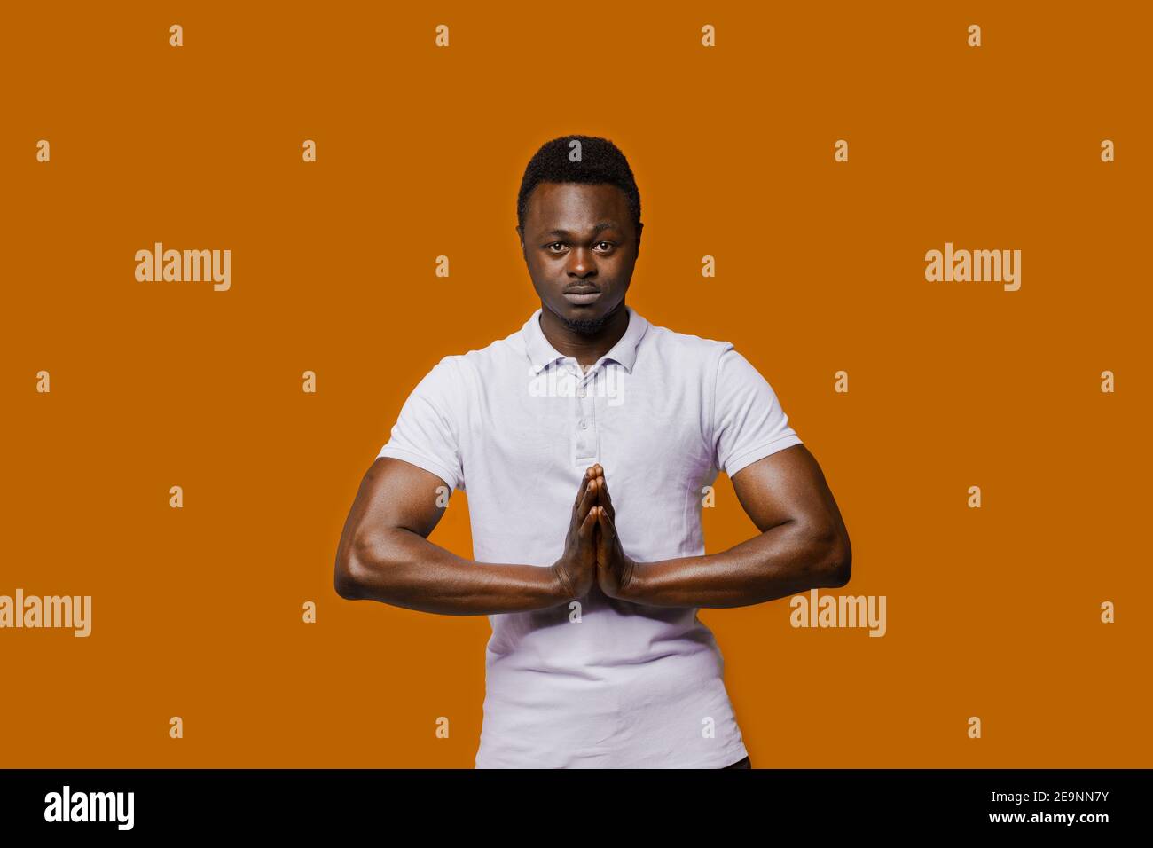 Relaxed black man closes eyes and does yoga. Calm and pacification of a ...