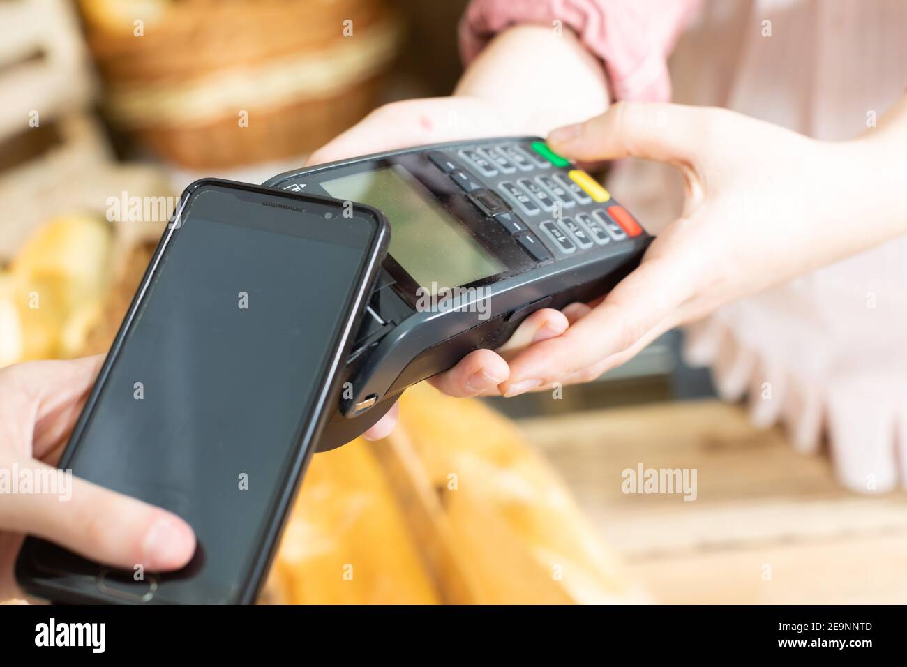 The client pays for the purchased bread through the payment terminal ...