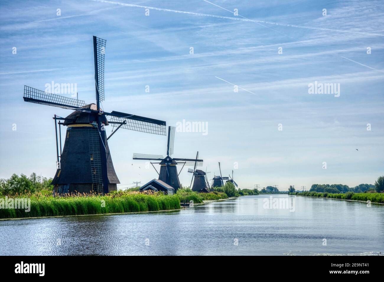 traditional dutch windmills at riverside, landscape picture in the ...