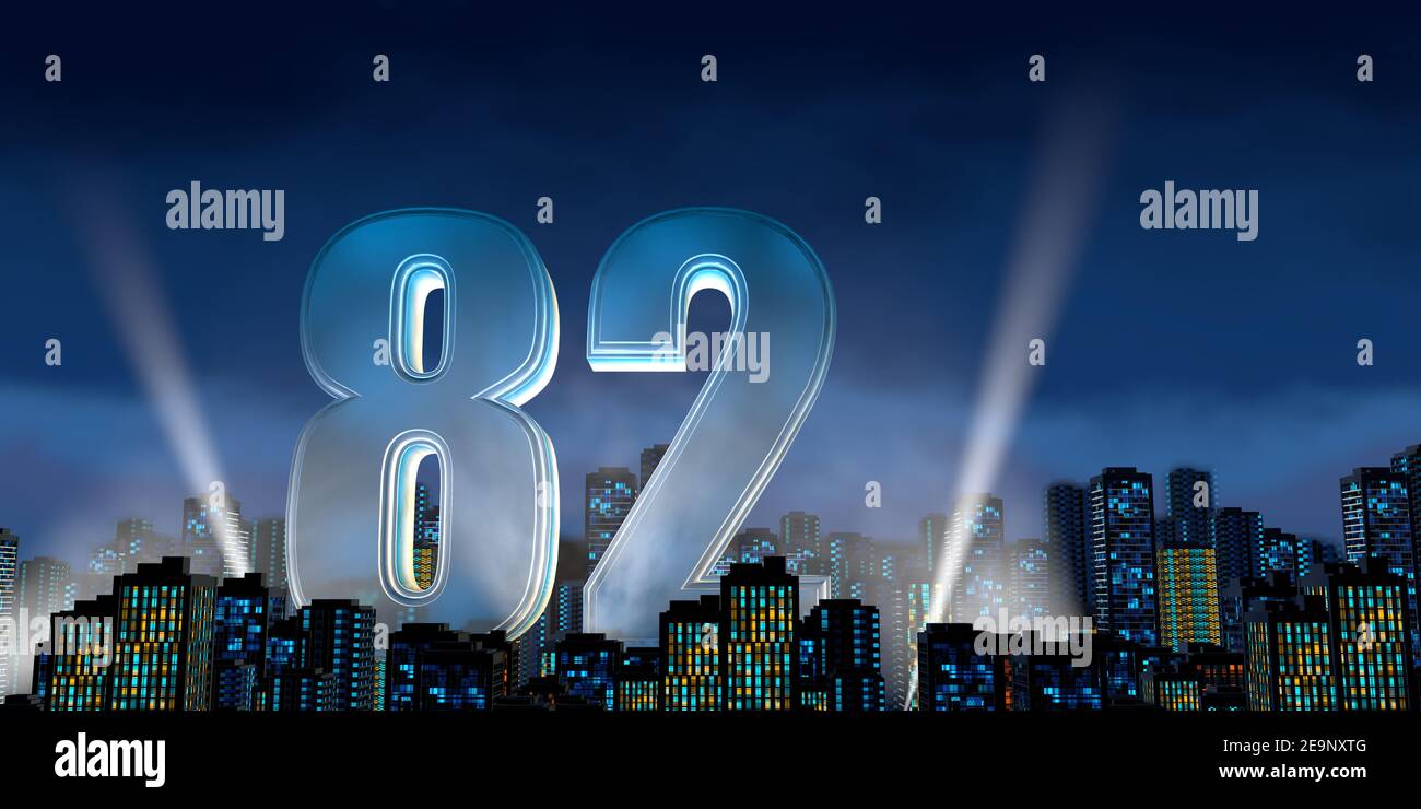 Number 82 in thick blue font lit from below with white light reflectors ...