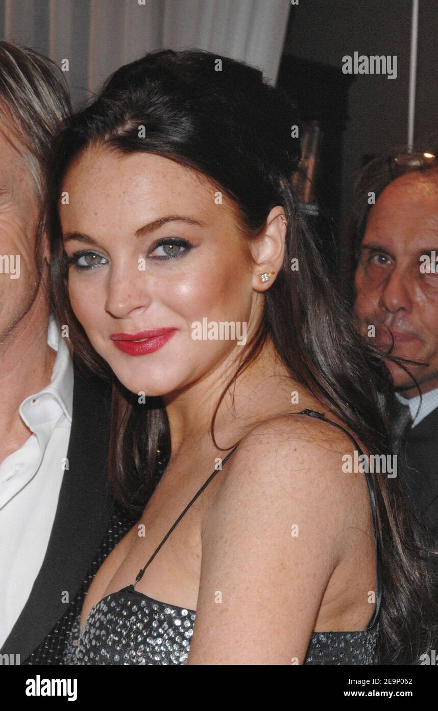 US actress Lindsay Lohan poses during the opening party for Tommy ...