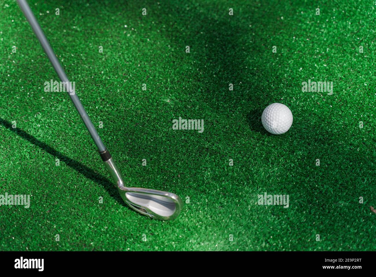 Niblick for playing mini golf sport game on the green grass. Advert for ...