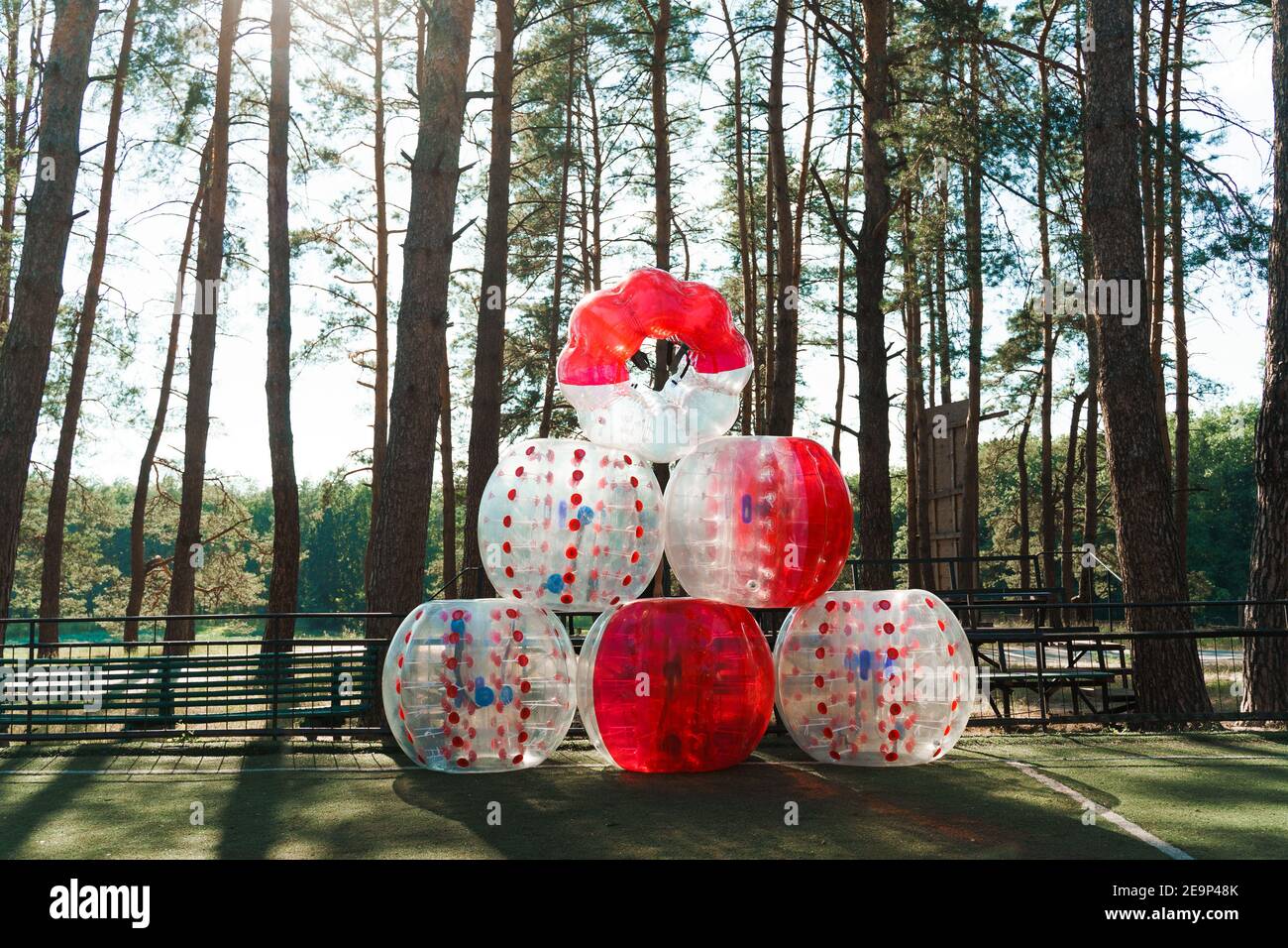Bubble ball balloons on the green field. equipment for team building ...