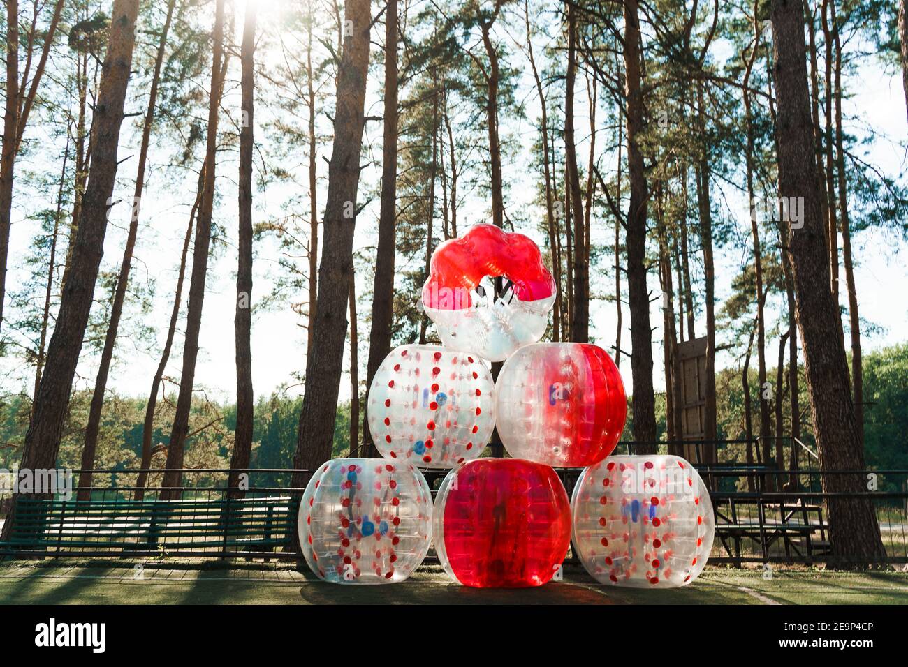Bubble ball balloons on the green field. equipment for team building ...