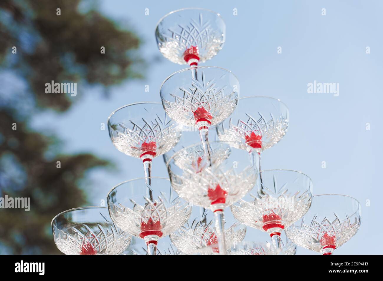 Wine glasses in pyramid of champagne close-up. Drink catering for ...