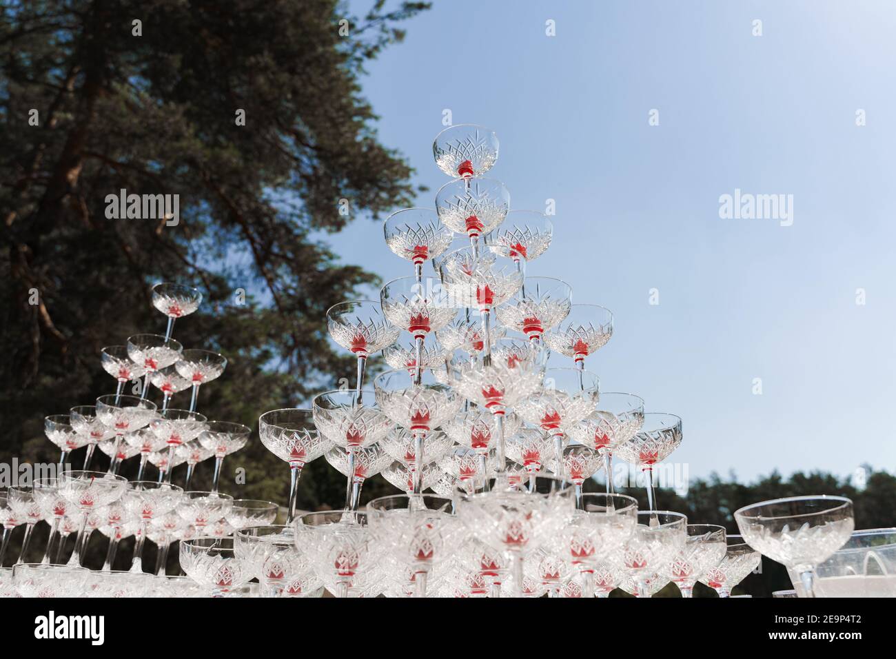 Wine glasses in pyramid of champagne. Drink catering for wedding ...