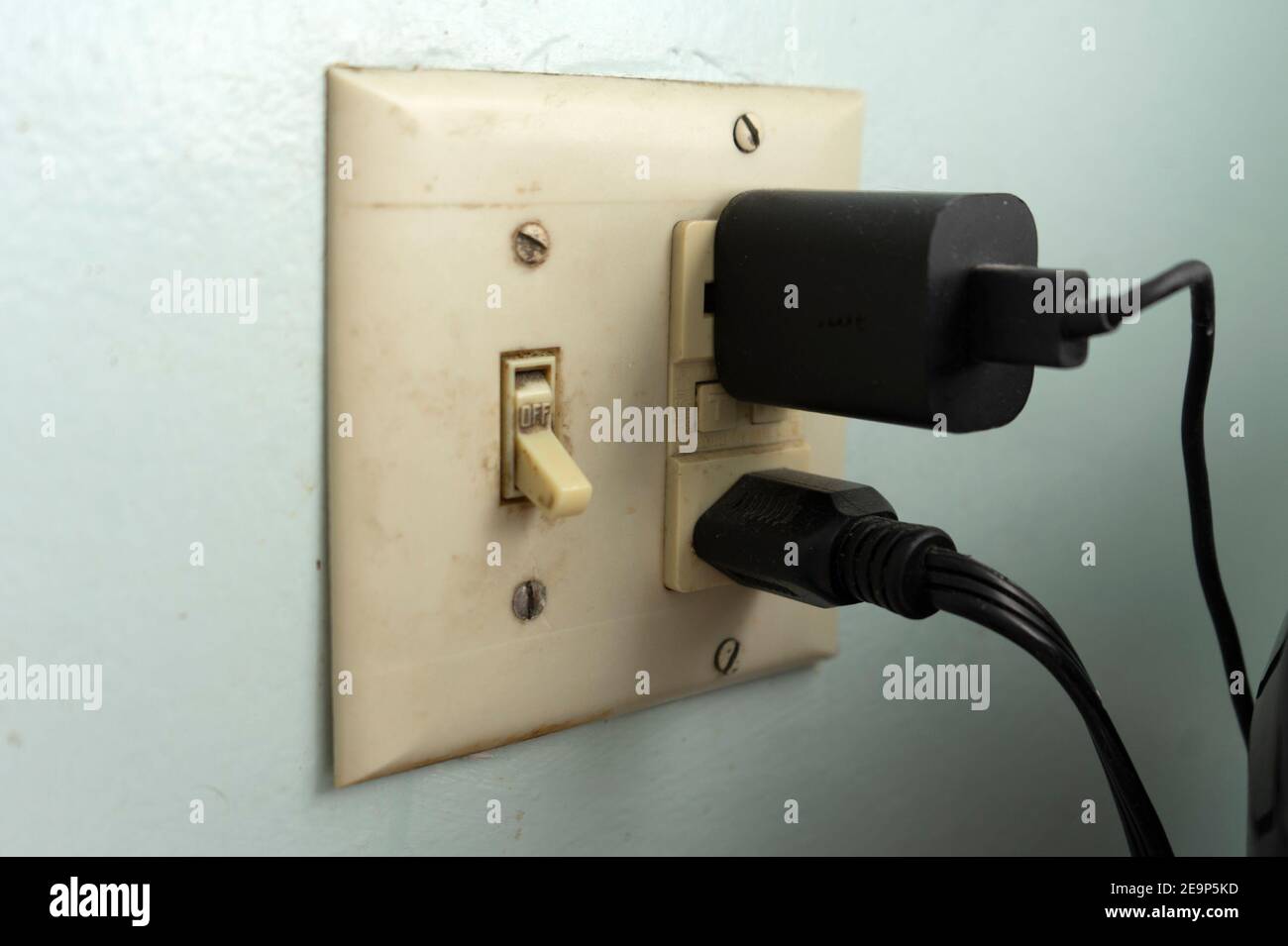 This dirty, grimy, yellowing light switch supports a few appliances via ...