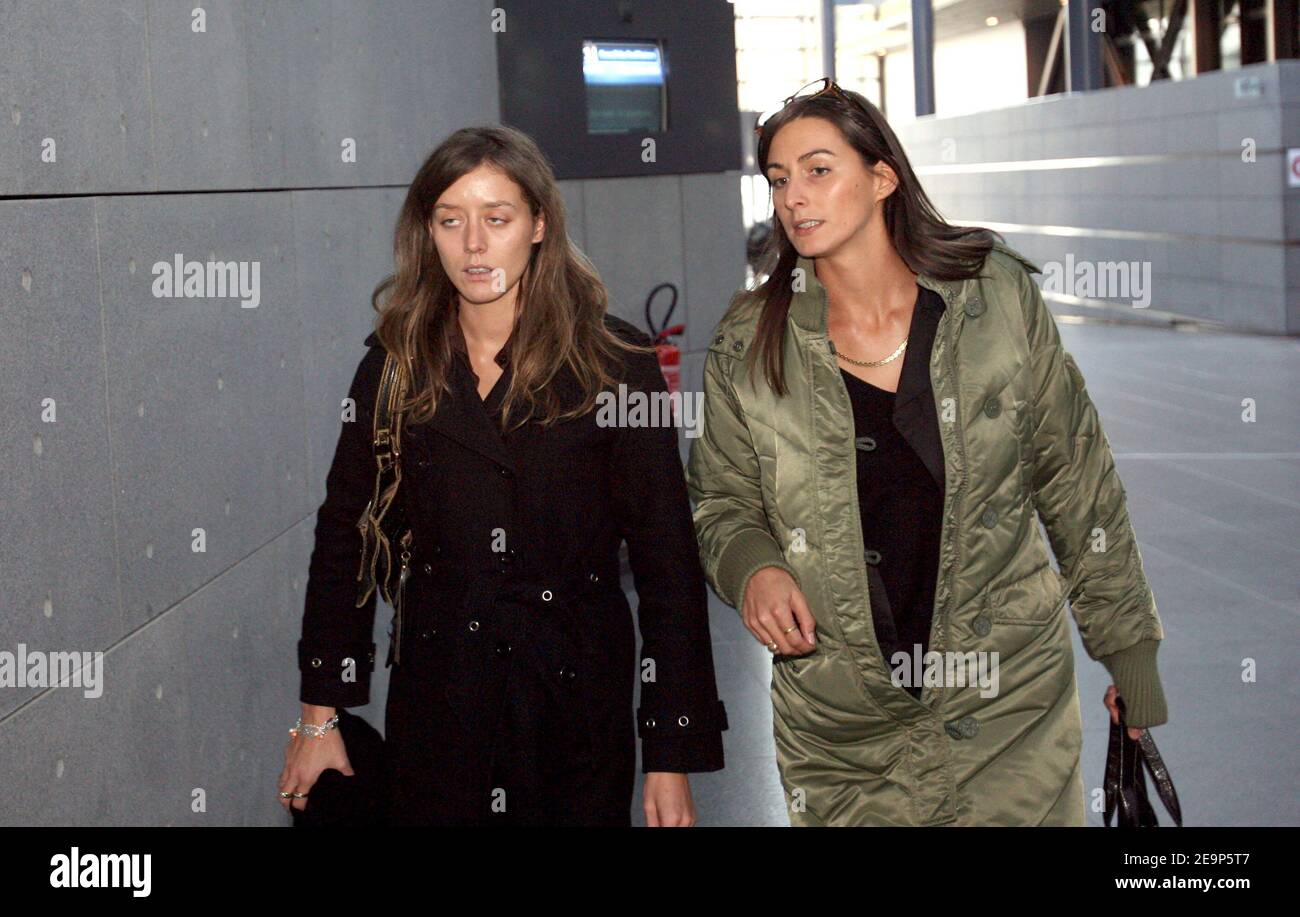 Angelique, left, and Celine Cecillon arrive to their father Marc ...