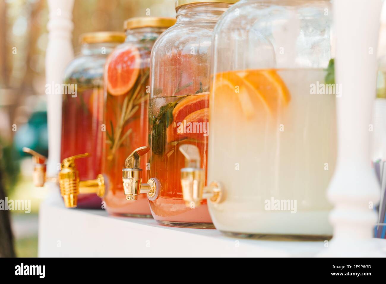 Lemonade dispenser with fruits: grapefruit, orange, lemon. Welcome zone ...