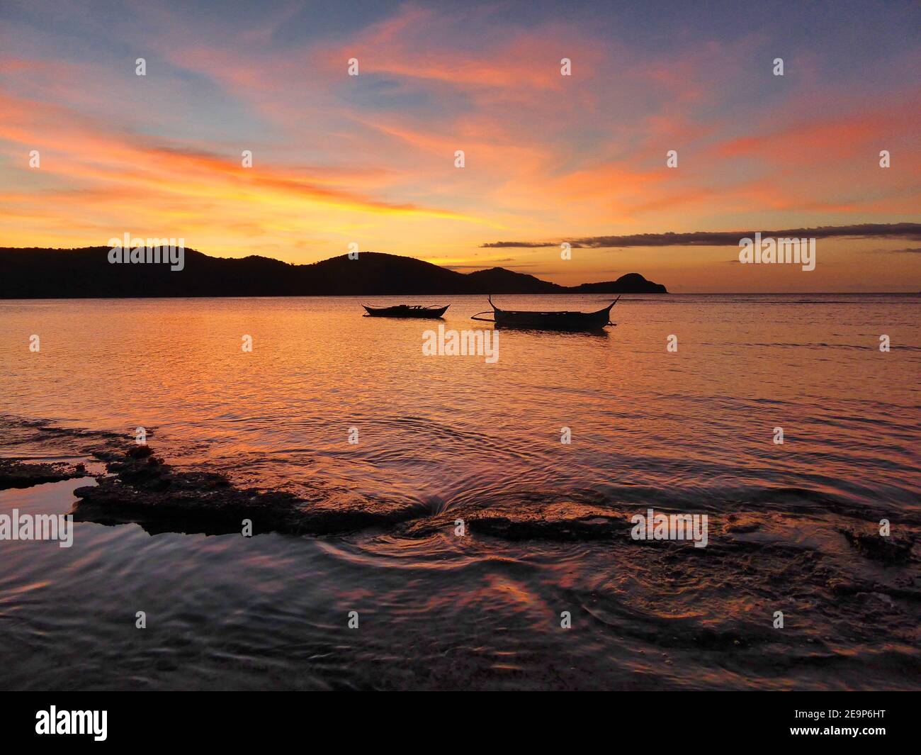 sunrise on the beach in the philippines Stock Photo - Alamy