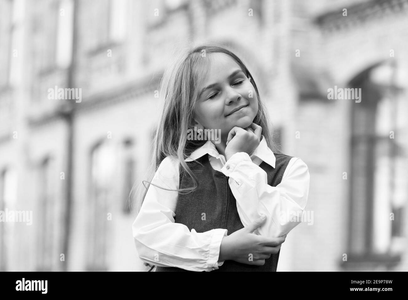 Let me think. Little kid lost in thoughts outdoors. Thoughtful look of ...