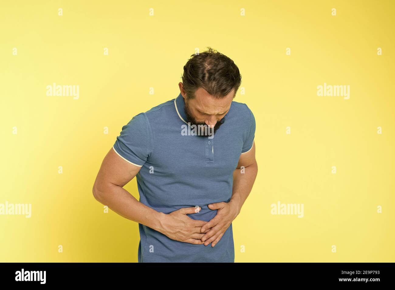 Sore stomach is killing me. Sick man suffer from stomach ache ...