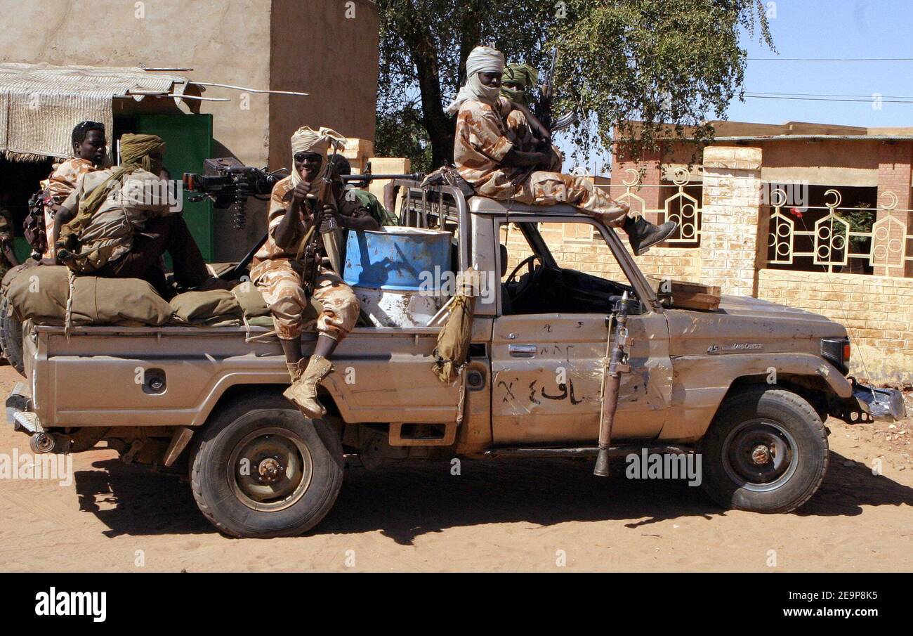 Rebels of Darfur driving the streets of Al Facher in Sudan aboard their ...