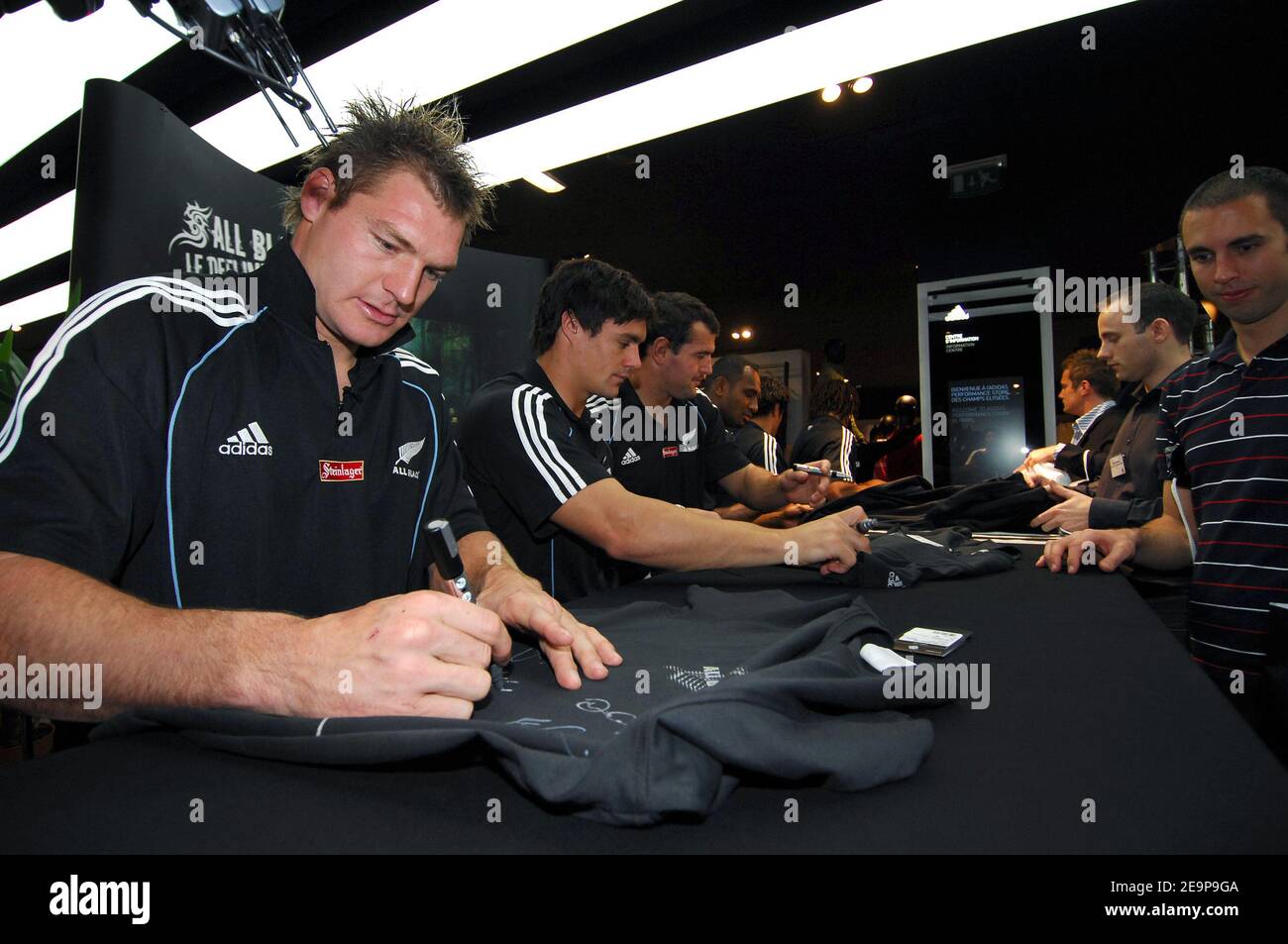 All Blacks' rugbyman Ali Williams signs autographs for their fans at ...