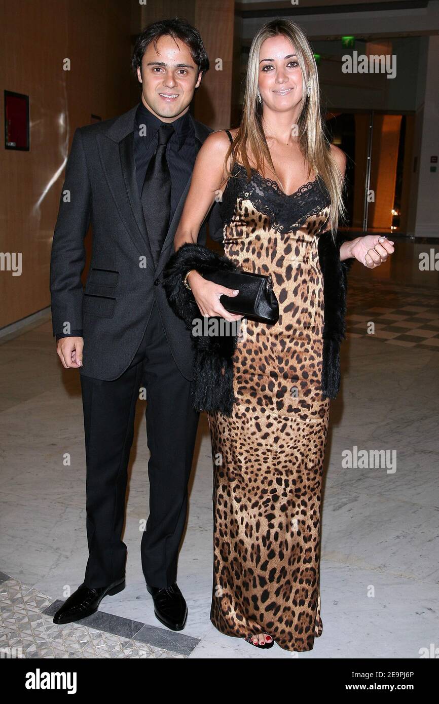 Formula One driver Felipe Massa of Brazil and his girlfriend arrive at ...