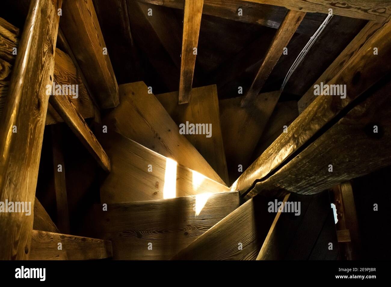 Wooden ancient spiral staircase in an old building. Old Tower stariway ...