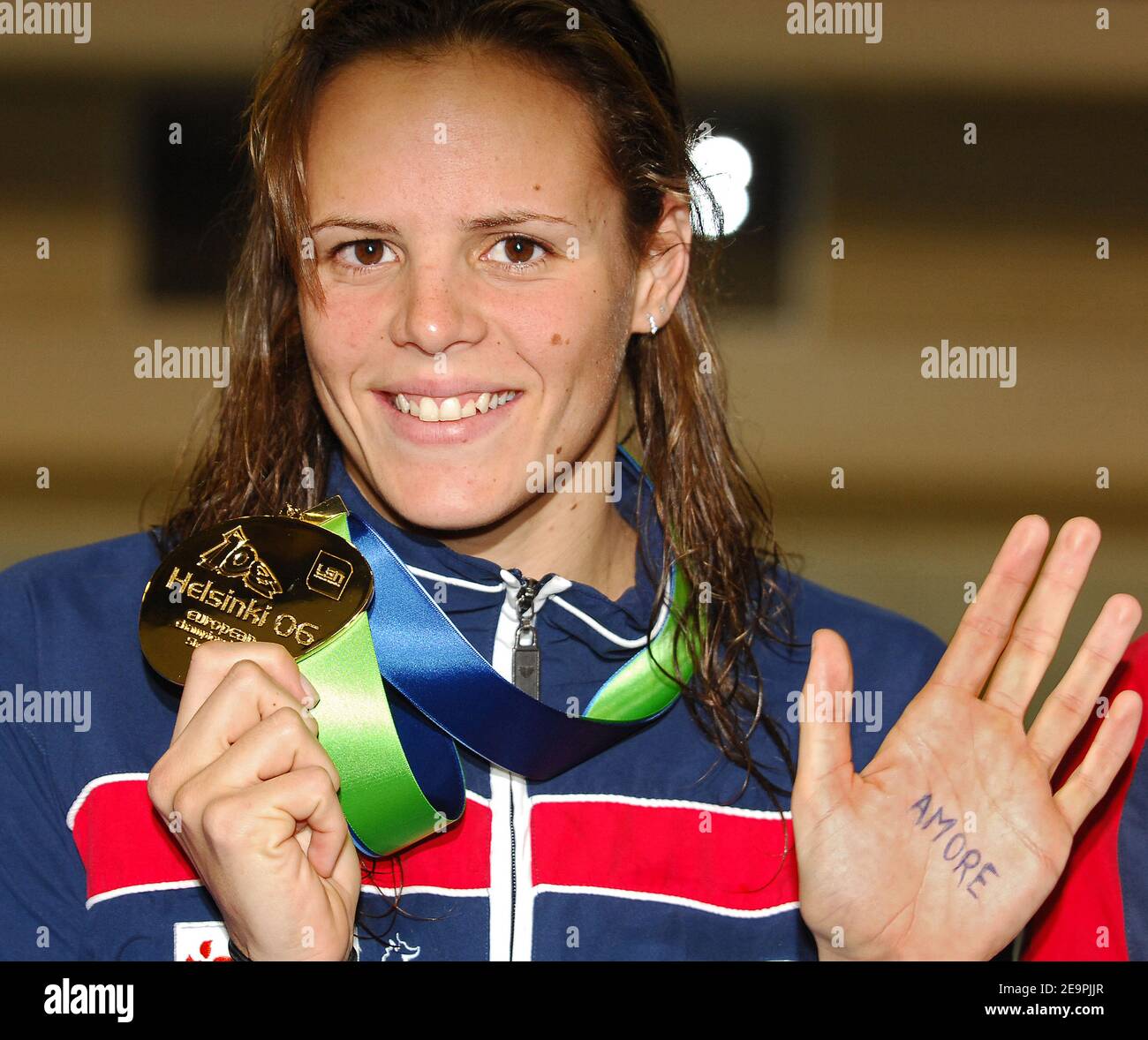 France's Laure Manaudou wins the gold medal and beats a new world ...