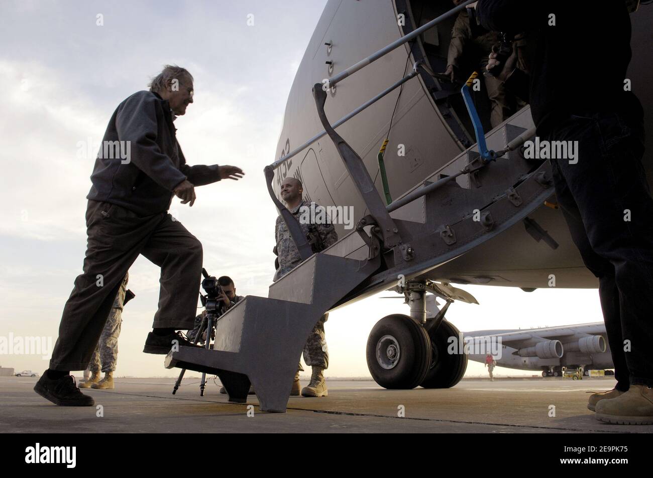Defense Secretary Donald H. Rumsfeld boards a C-17 after visiting with ...