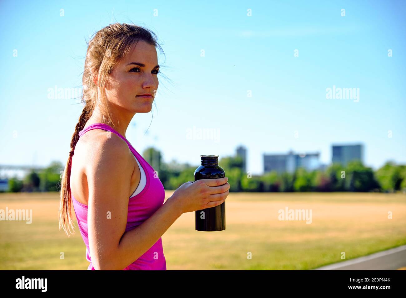 Female athlete taking a water break during workout, Montreal, Quebec ...