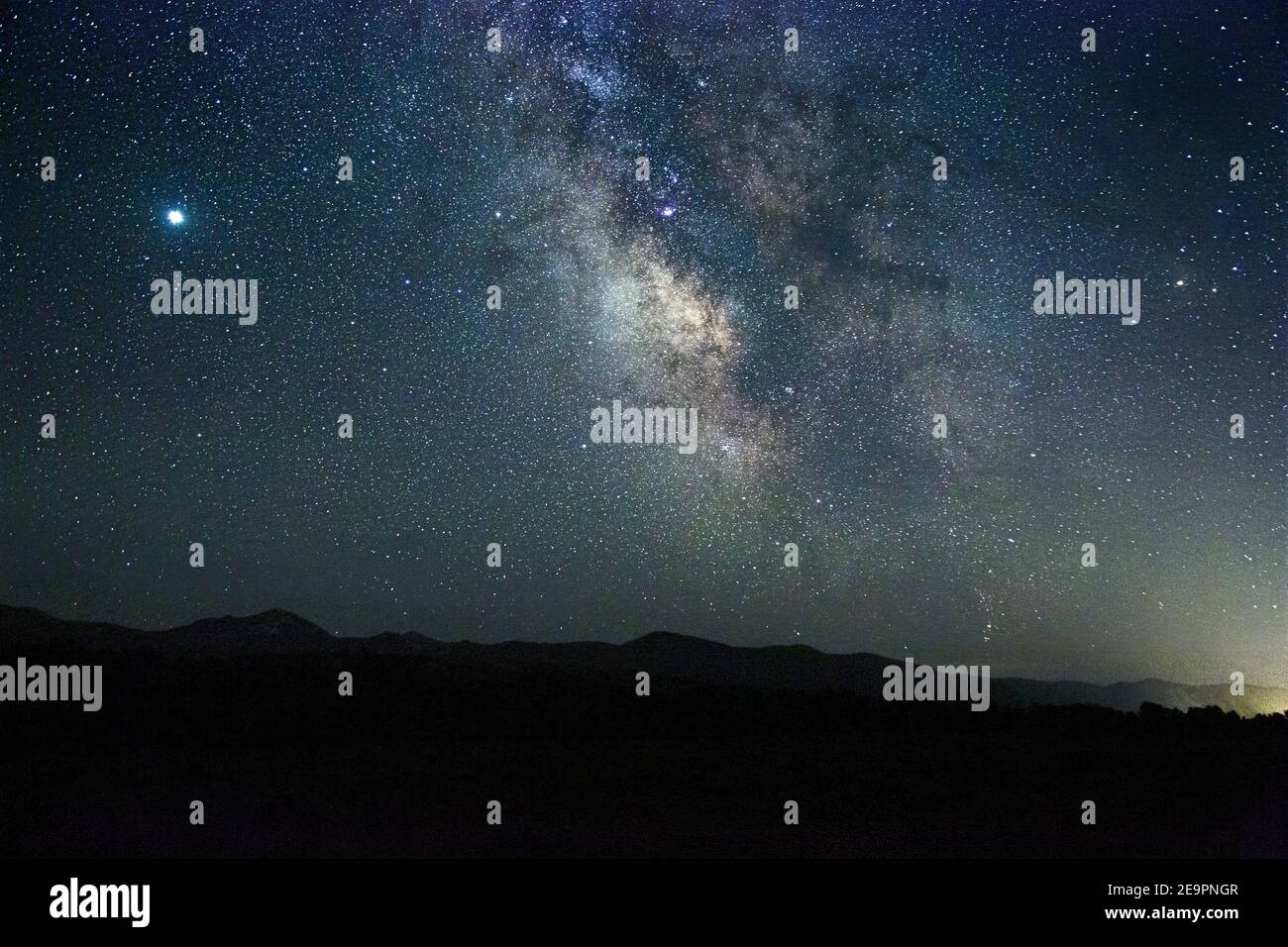 Jupiter shining in the night sky with the Milky Way Galaxy as it ...