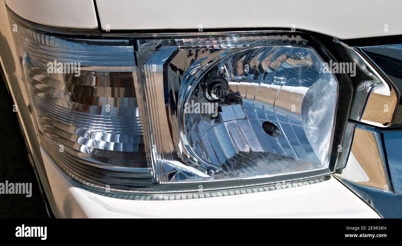 Headlight xenon lamp car background Stock Photo - Alamy