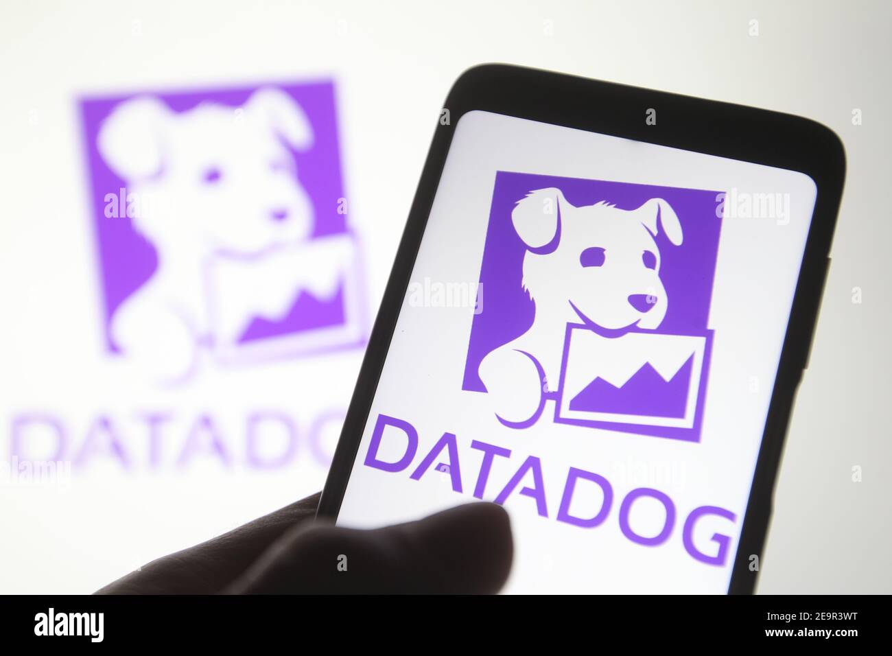 In this photo illustration a Datadog logo is seen on a mobile phone and ...