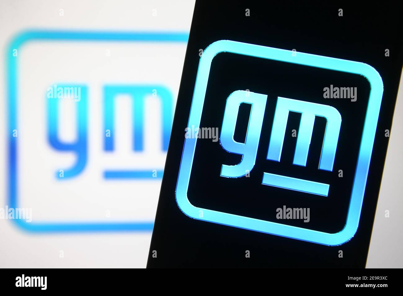 In this photo illustration the General Motors (GM) logo is seen on a ...