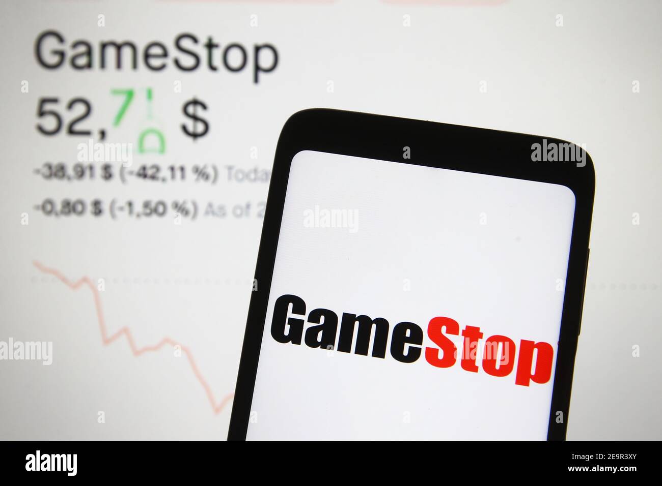 In this photo illustration a GameStop logo is seen on a mobile phone ...