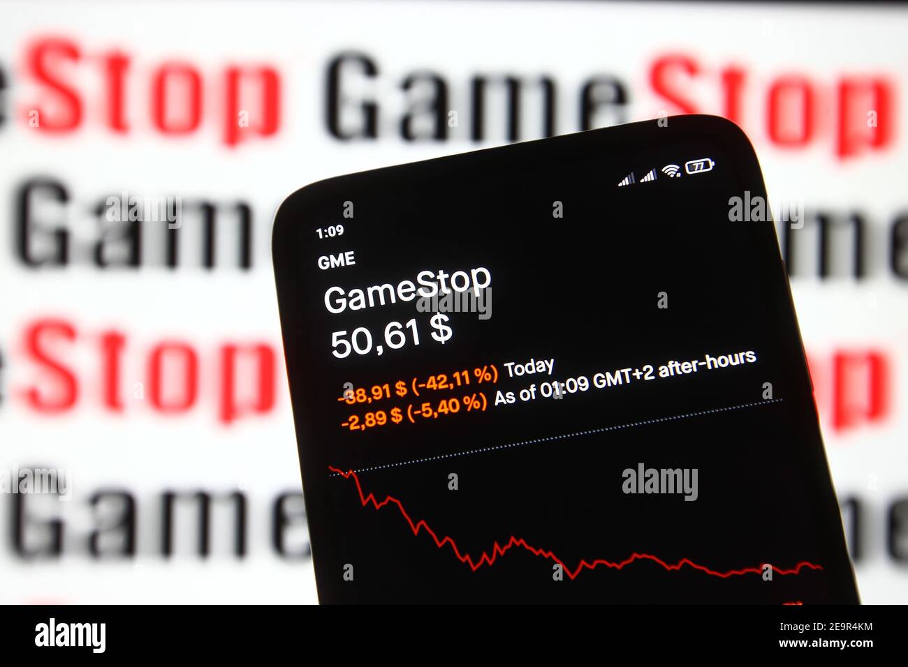 In this photo illustration a GameStop logo is seen on a screen in front ...