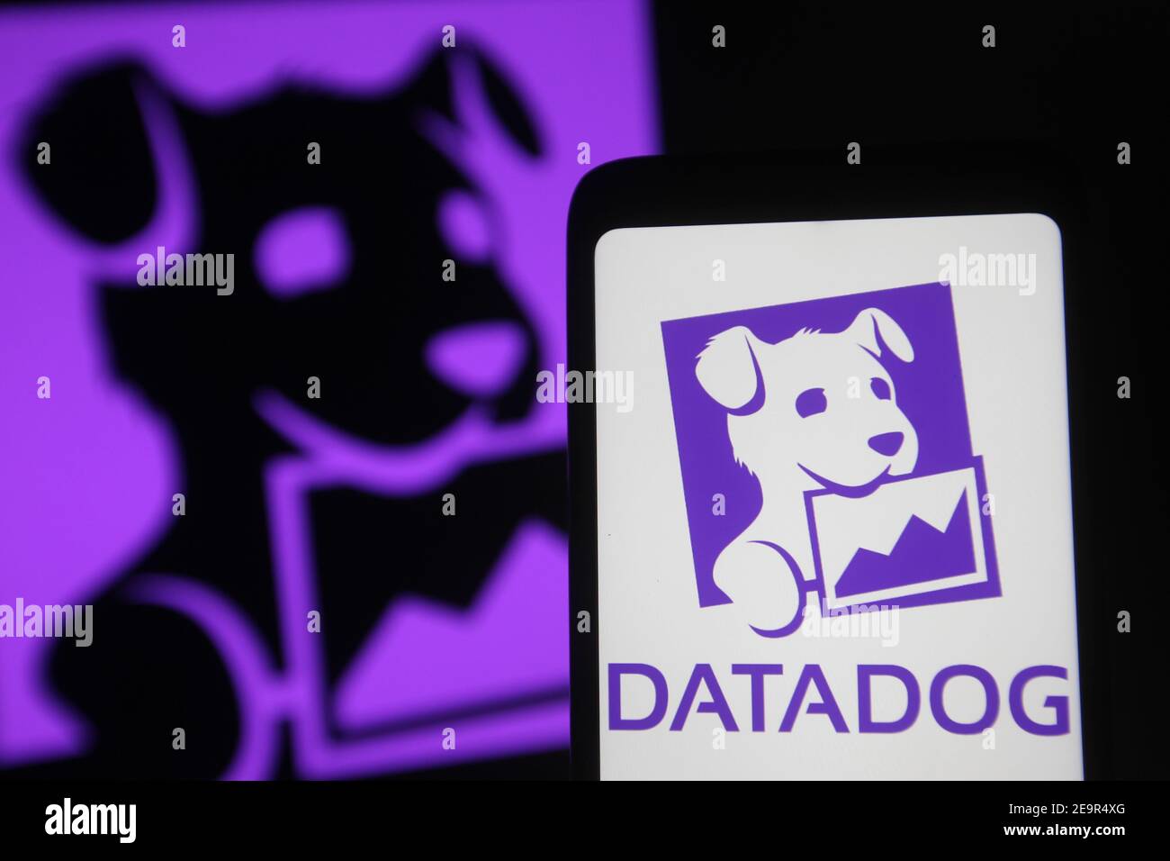 In this photo illustration a Datadog logo is seen on a mobile phone and ...