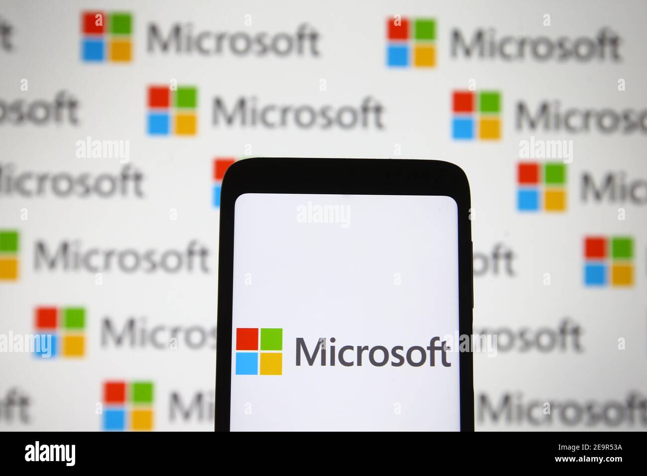 In this photo illustration a Microsoft logo is seen on a mobile phone ...