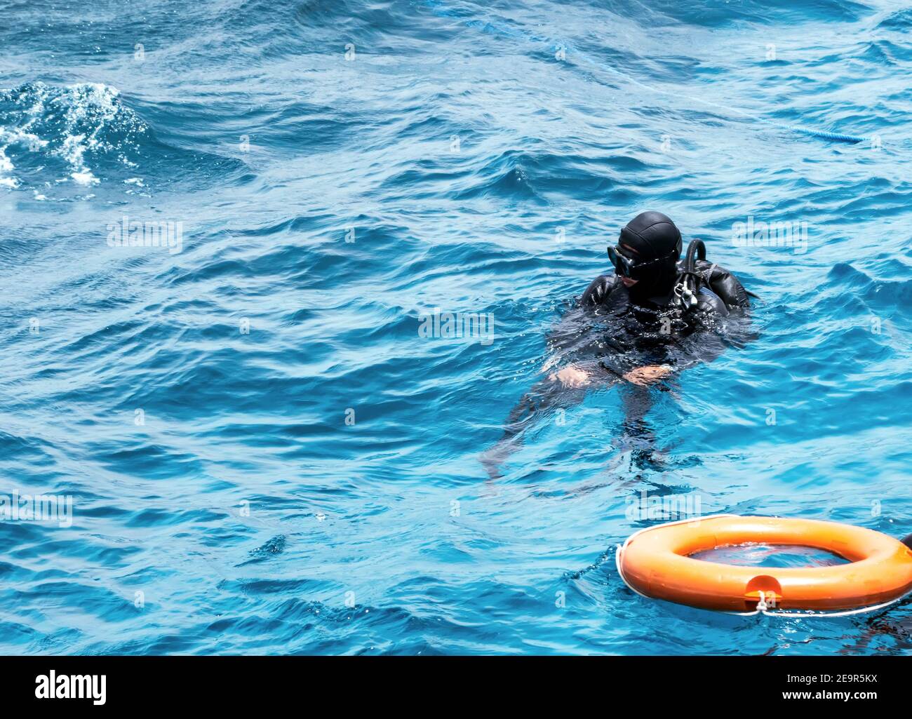 Scuba diver. Safety equipment orange lifebuoy ring. Life buoy or rescue ...