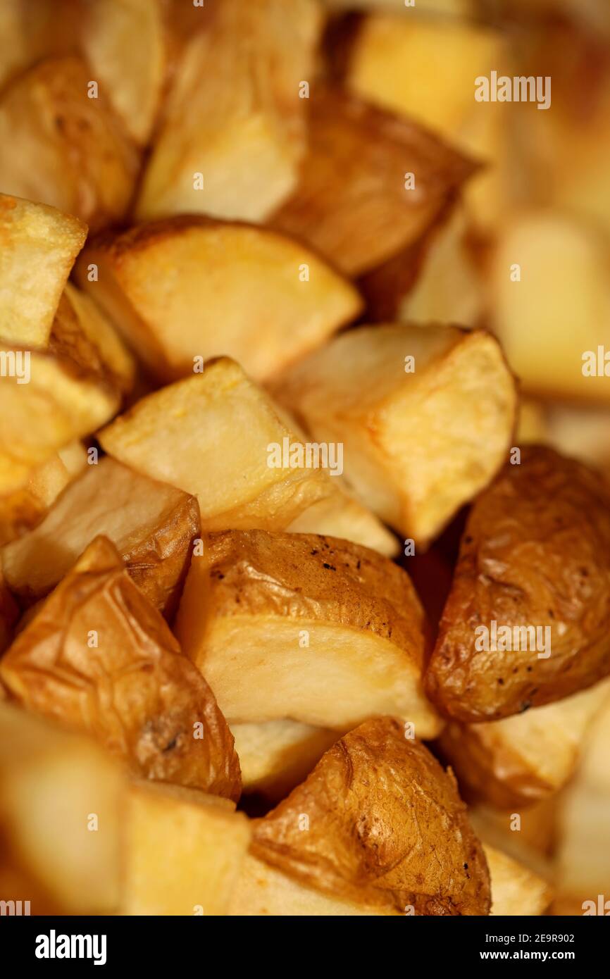 Cutting potatoes in small pieces close up catering background modern ...