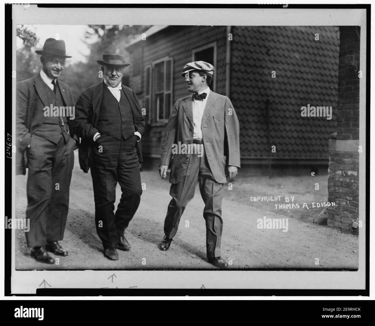 Mr. Thomas Edison walking in laboratory yard with Messrs. Miller Reese ...