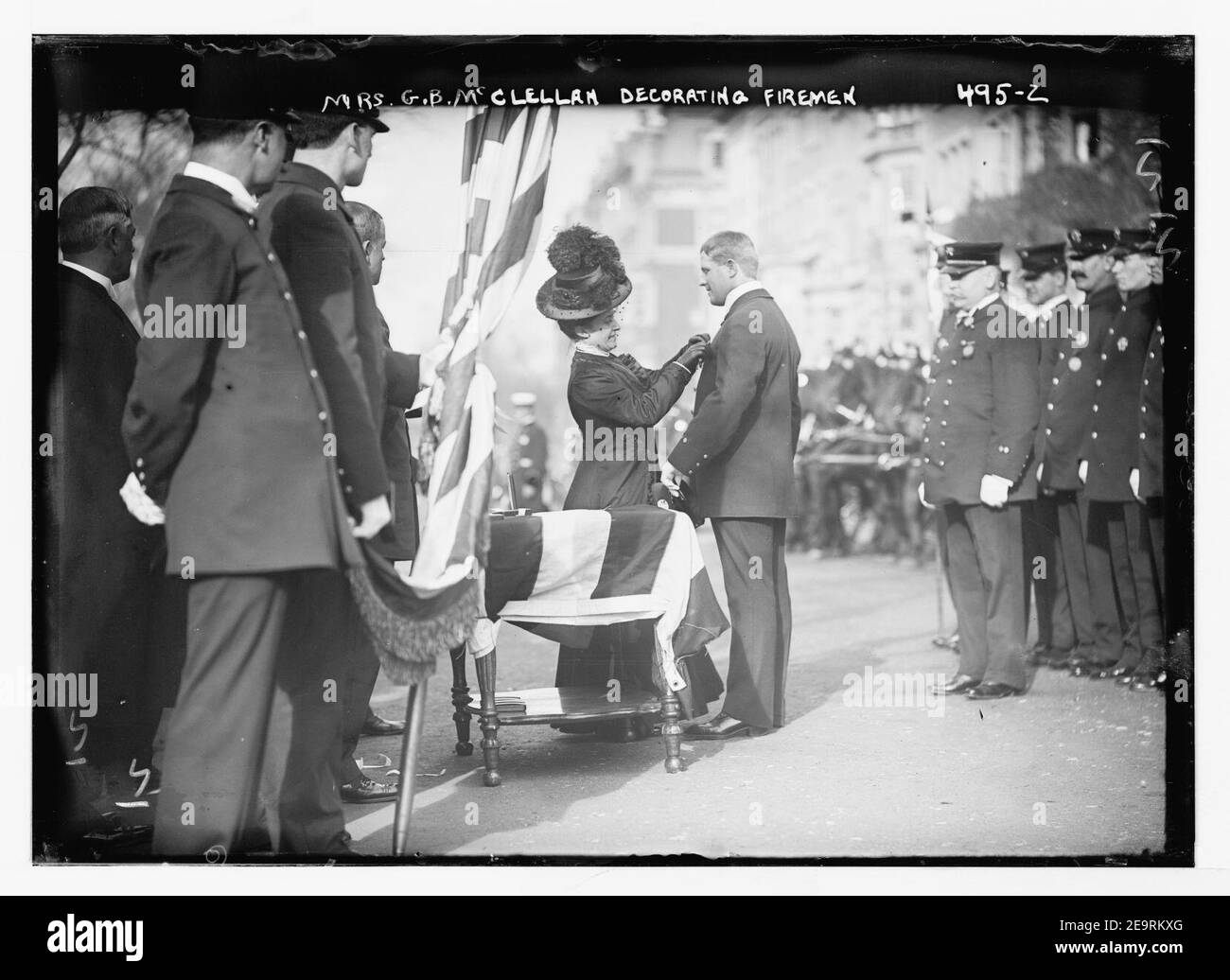 Mrs. G.B. McClellan decorating firemen, (New York Stock Photo - Alamy