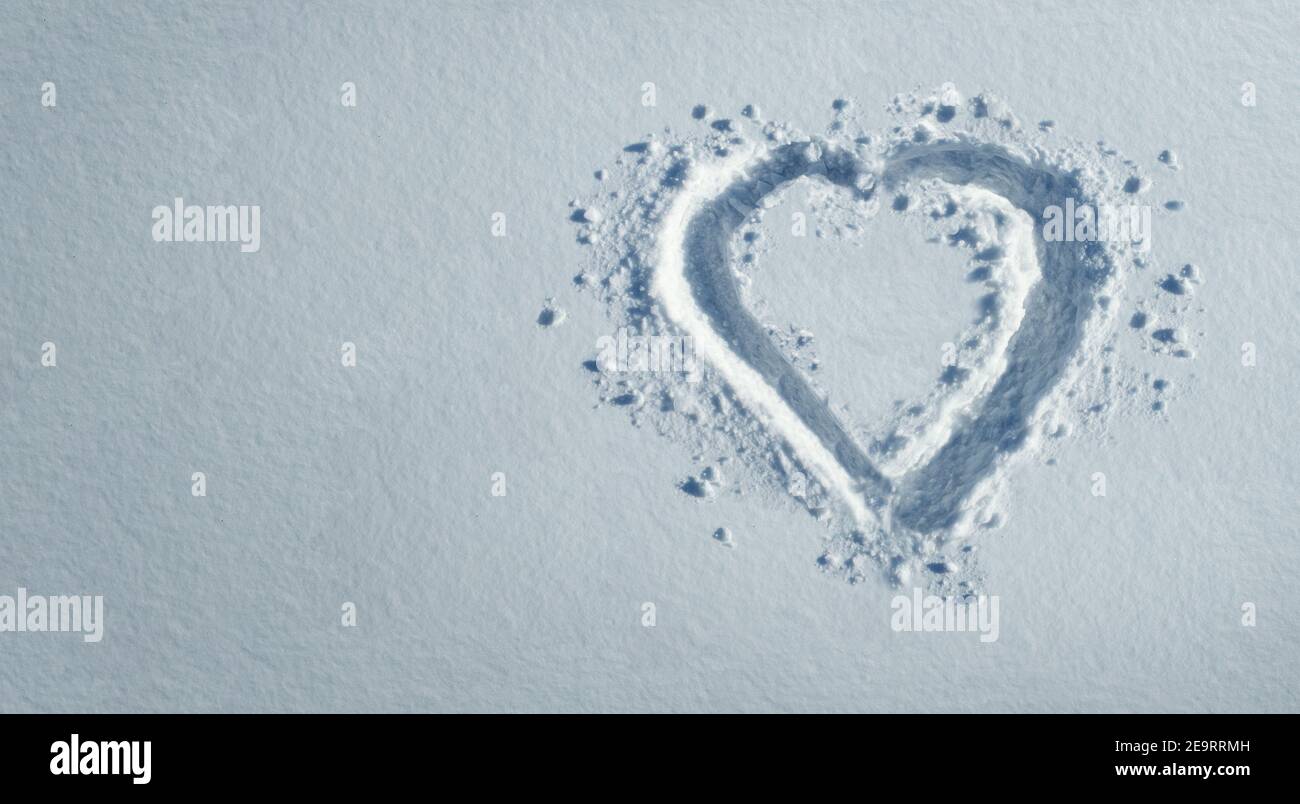 Snow heart and winter love symbol as a romance shape greetings with ...