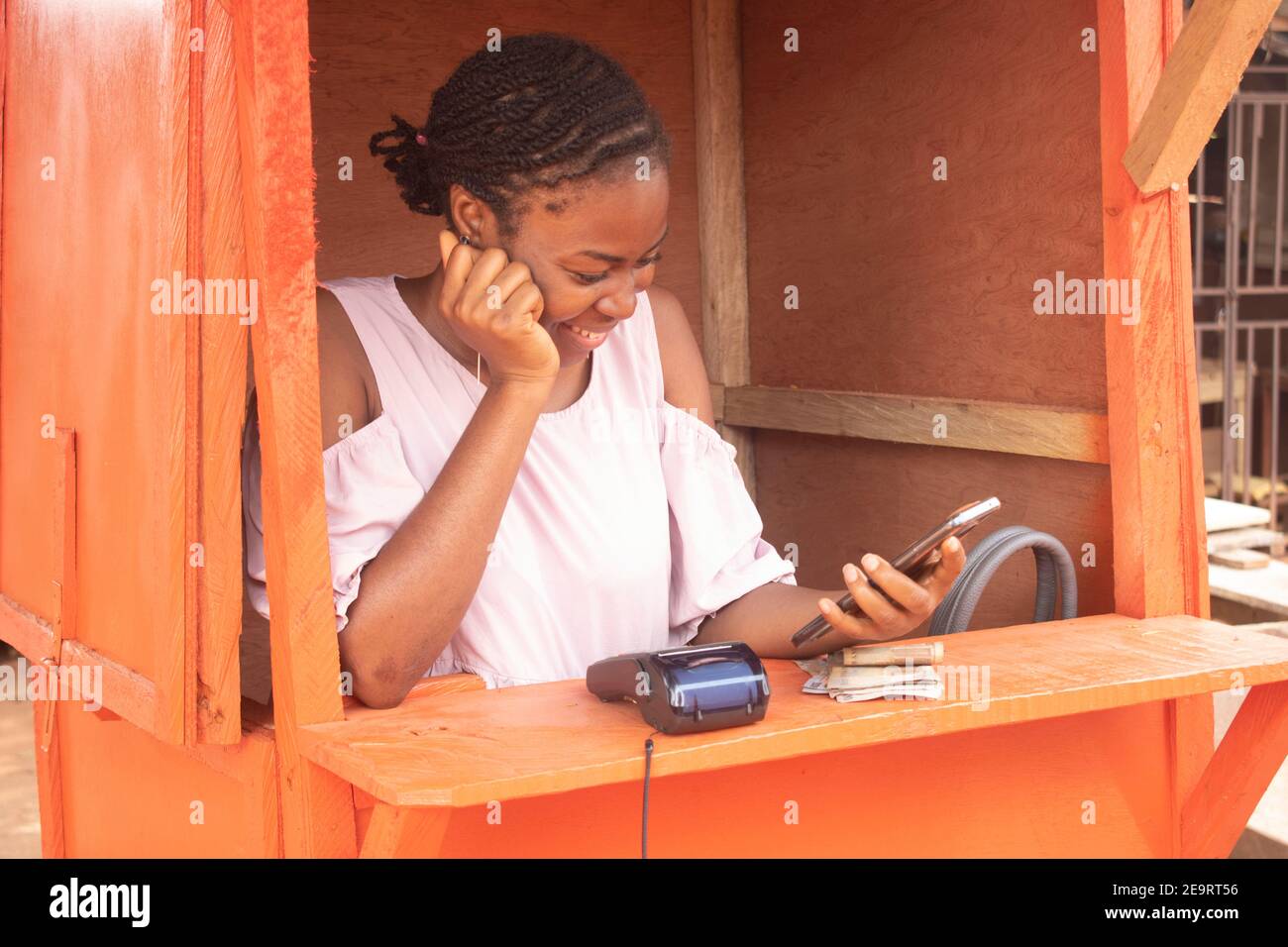 an african lady making use of her pos machine Stock Photo - Alamy