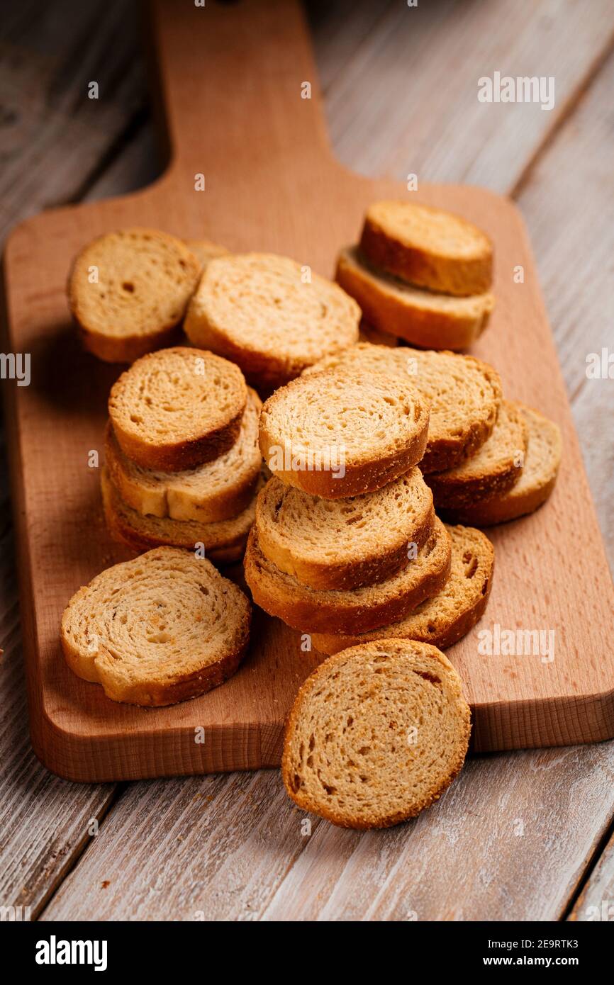 Dried bread crackers on the wooden background Stock Photo - Alamy